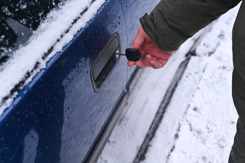 A Man Opens the Car Door with a Key in Winter. Stock Image - Image of ... A Man Opens the Car Door with a Key in Winter. Stock Image - Image of ...