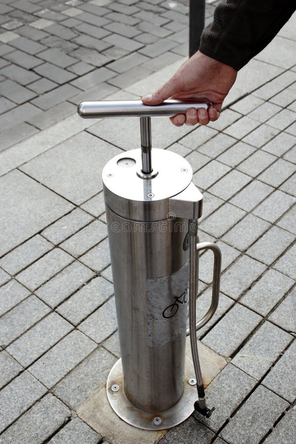 Man`s Hand Lifting City Steel Bicycle Pump Handle Stock Image - Image ...