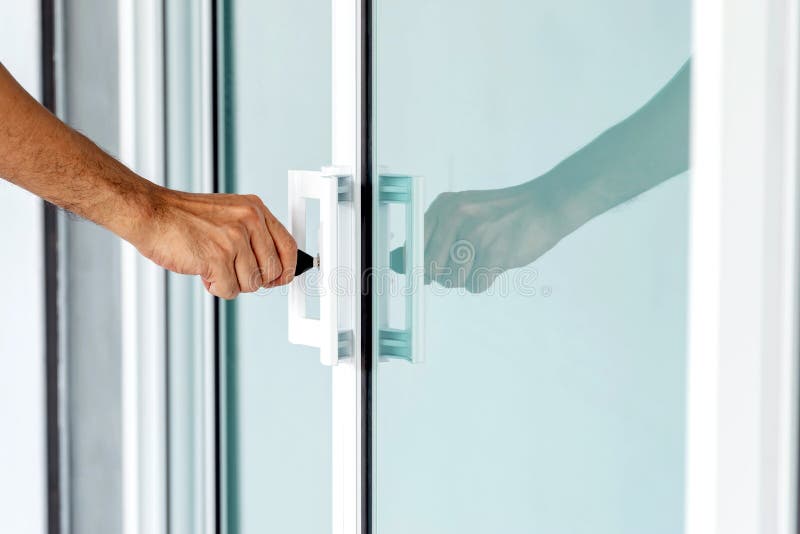 Man`s Hand Opening a Glass Door with a Key Stock Image - Image of ...