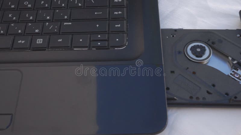 A Man S Hand Opens the Computer S Drive and Inserts the Disk. Stock ...