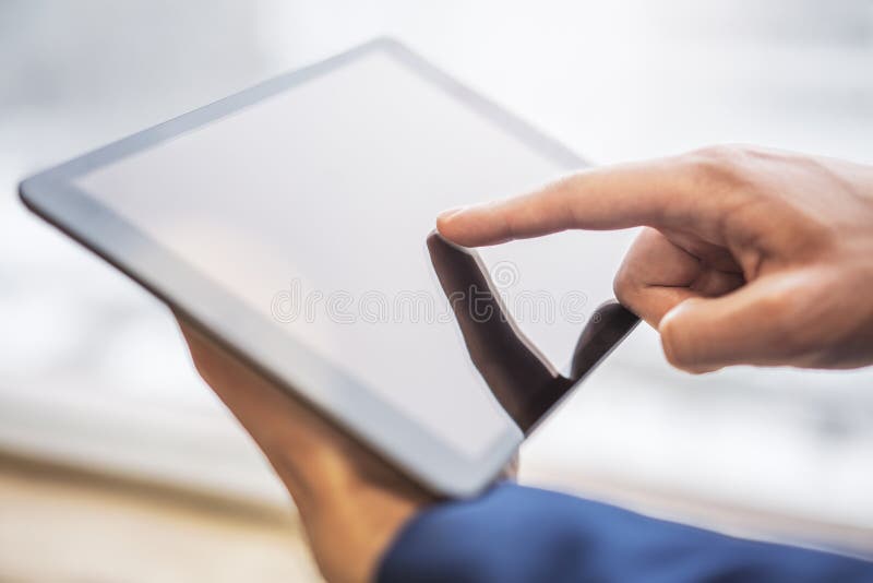Man S Hand Operating a Modern Tablet Device Placed on a Desk Stock ...