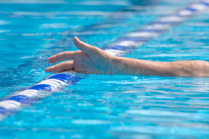 Man`s hand in pool water stock photo. Image of underwater - 172324956