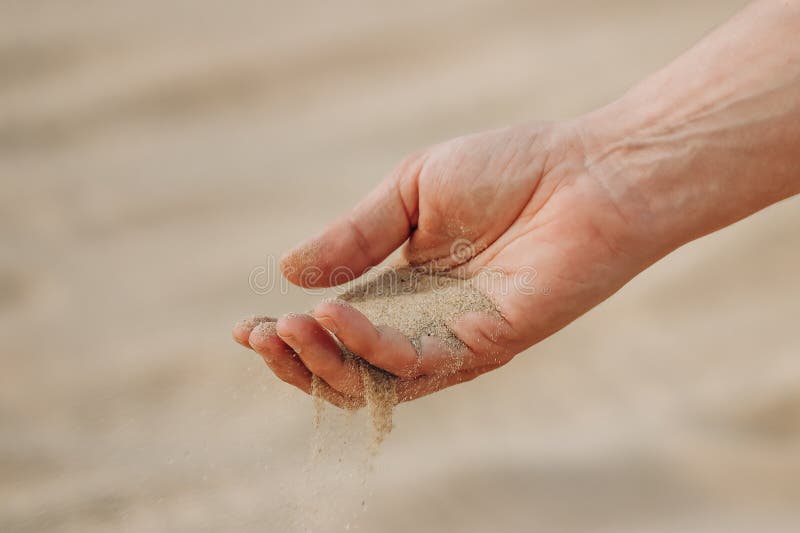 A Man S Hand Pouring Sand in the Desert Stock Photo - Image of parched ...