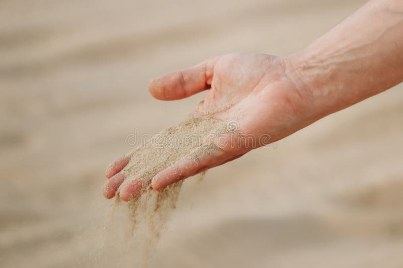 A Man S Hand Pouring Sand in the Desert Stock Photo - Image of arabian ...