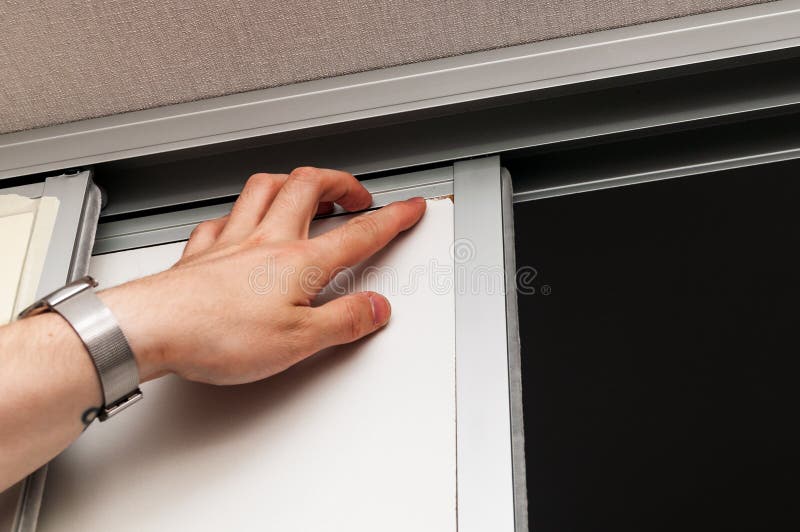 The Man`s Hand Presses the Panel of the Cupboard Door Stock Image ...