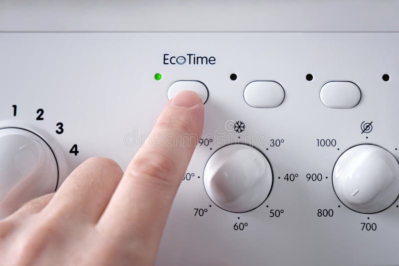 A Man S Hand Pressing the Button for Selecting the Economical Washing ...