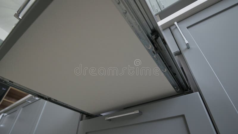 Pulling Out and Closing the Drawer at Modern Classic Gray Kitchen Stock ...