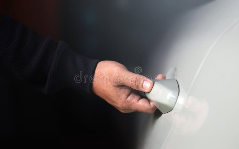 A Man S Hand Reaching To Open a Car Door. the Image Represents the ...