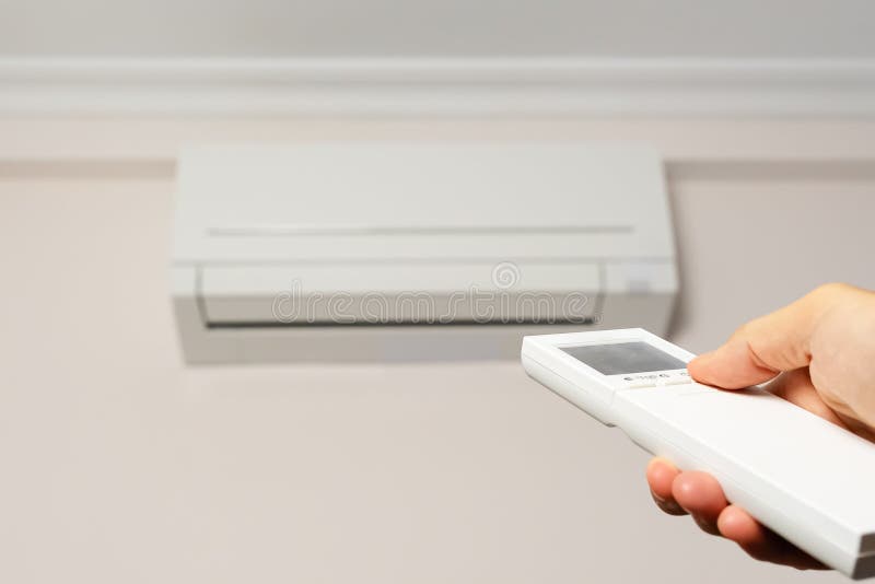 Man& X27;s Hand with Remote Control Turning Off the Air Conditioner ...
