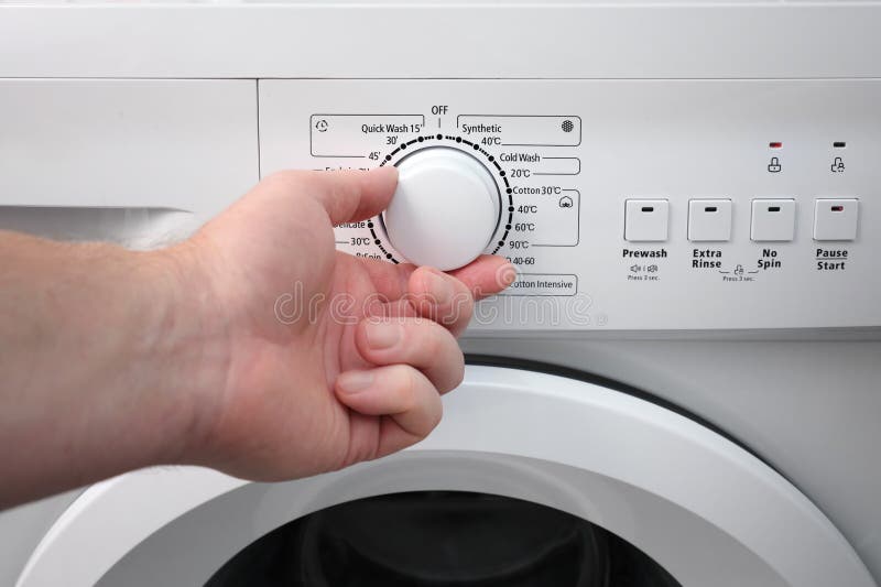A Man S Hand Sets the Automatic Washing Program Switch on the Washing ...