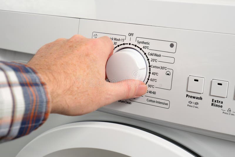 A Man S Hand Sets the Washing Mode Temperature Switch on the Washing ...