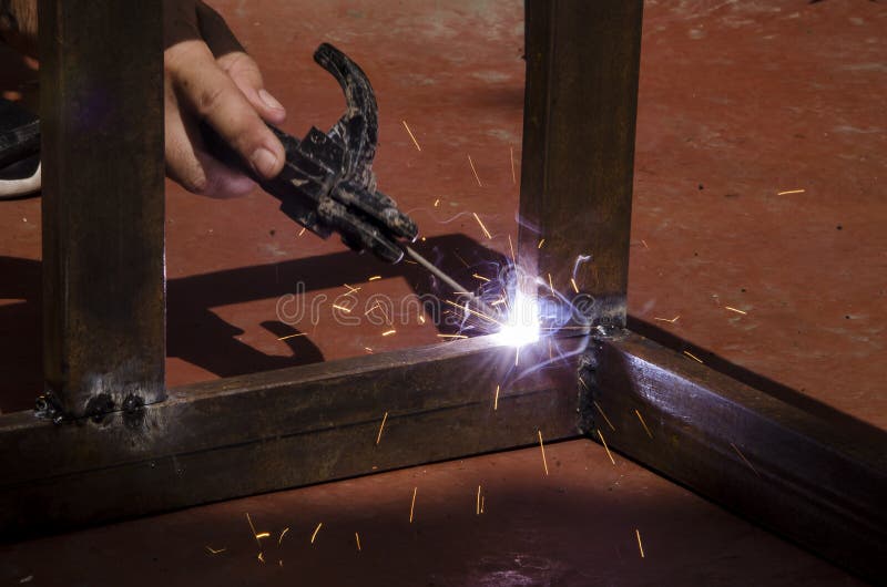 Hand with Soldering Iron stock photo. Image of occupation - 102014838