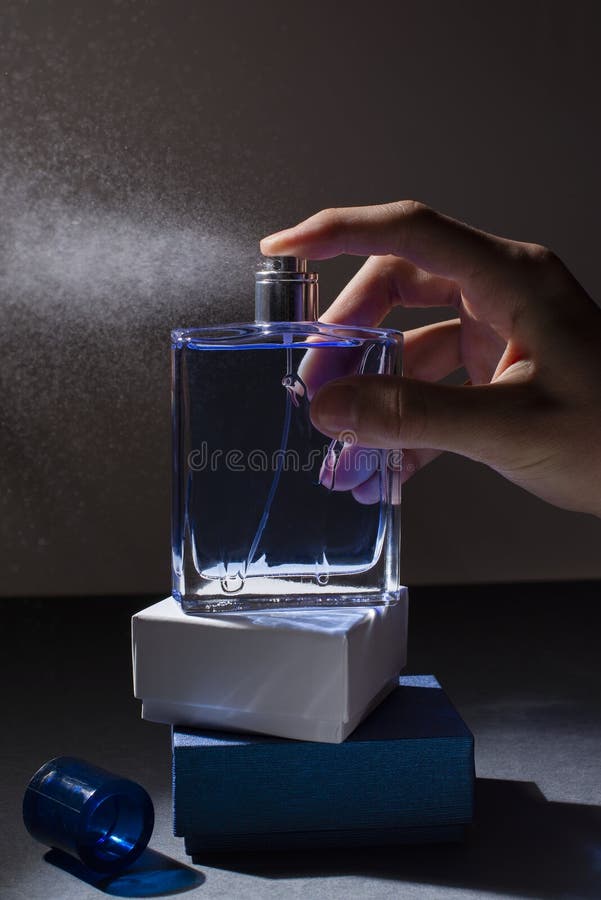 Hand, Spray, Perfume in the Dark Bacground Stock Photo - Image of ...