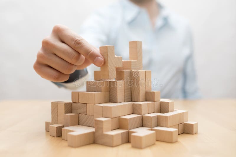 Man`s Hand Stacking Wooden Blocks Stock Photo - Image of group, company ...