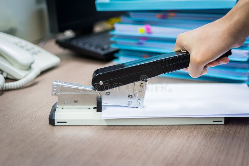 Man s hand stapling paper stock image. Image of table - 59934507