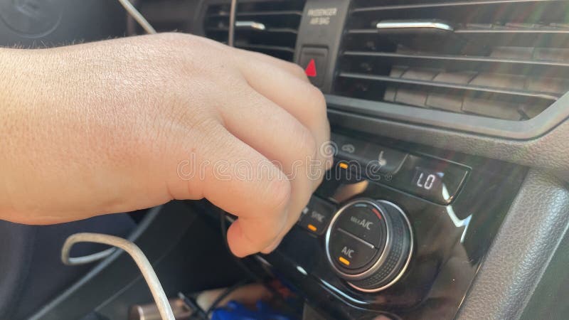 A Man S Hand Switches the Temperature Control Lever on the Dashboard of ...