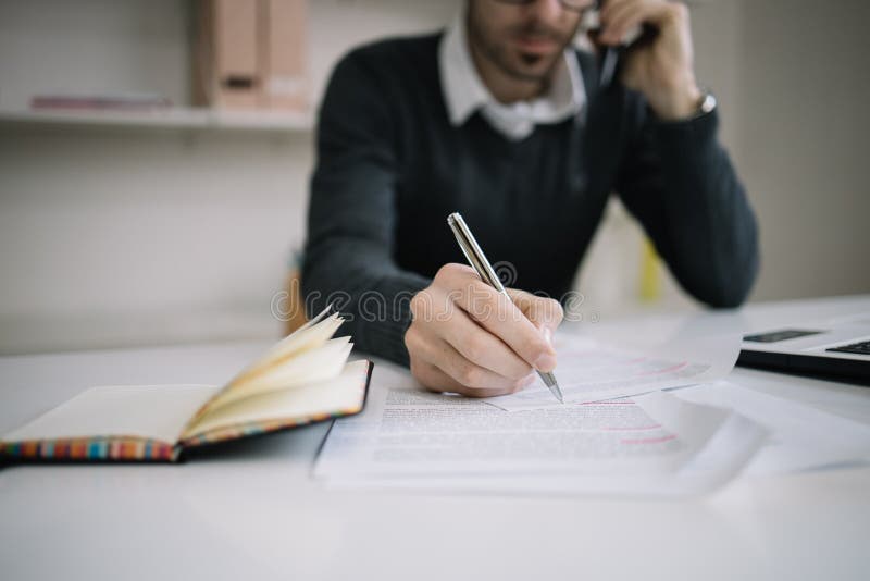 Man`s Hand Taking Notes in Business Documents Stock Image - Image of ...