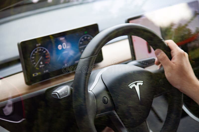 Man S Hand on the Tesla S Steering Wheel Editorial Stock Image - Image ...
