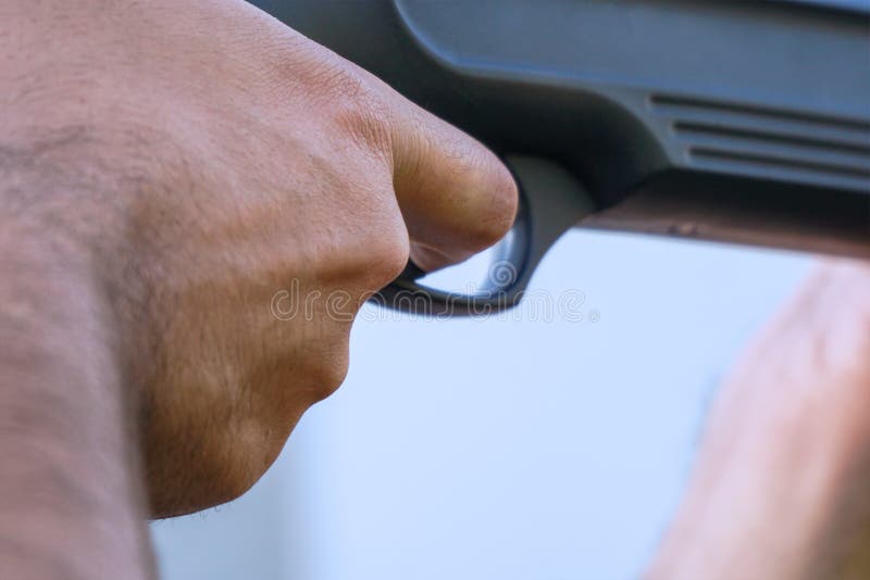 Man`s Hand is on the Trigger of the Rifle. Selective Focus Stock Image ...