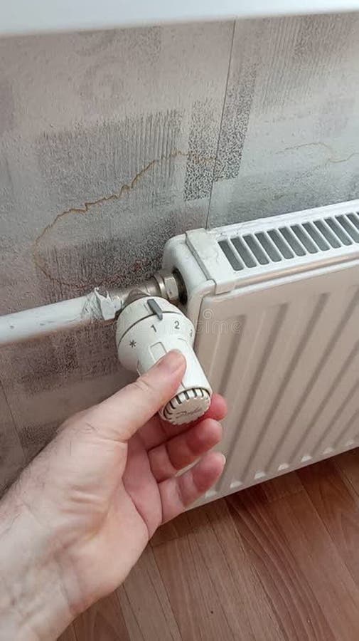 A Man S Hand Turns the Battery-powered Radiator Stock Video - Video of ...