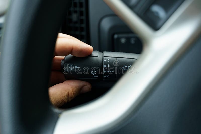A Man S Hand Turns on the Windshield Wiper Switch Control Lever in a ...
