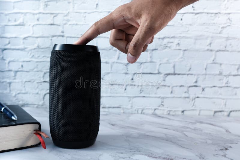 Man`s Hand Using Smart Speaker on Table Stock Photo - Image of speaker ...