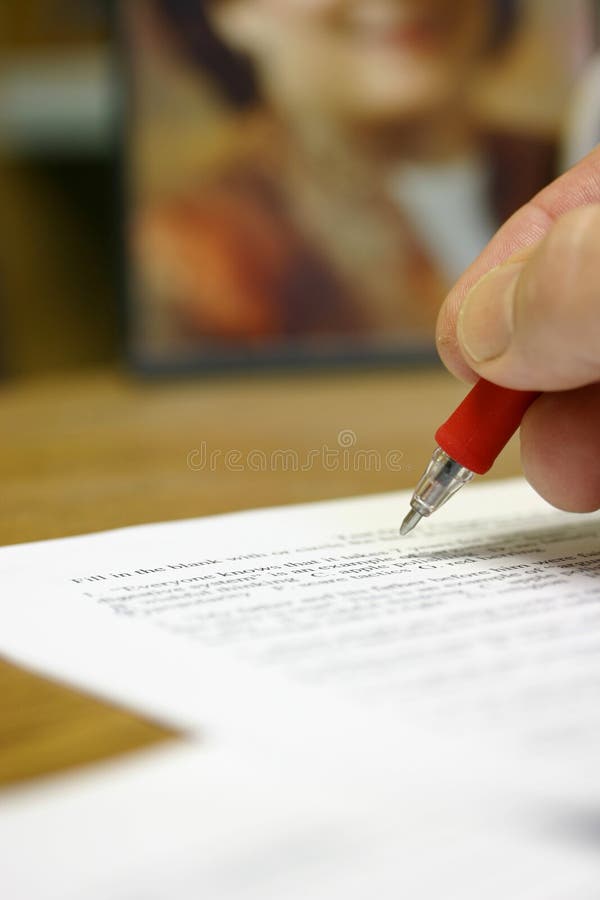 Man S Hand Writing at Desk Grading a Paper Stock Image - Image of test ...