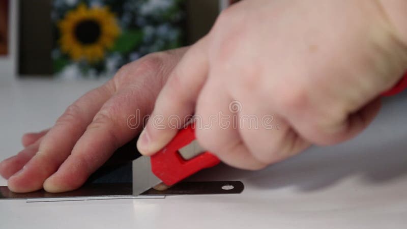 The Man S Hands Carefully Cut Out a Magnet with a Knife. Asmr Stock ...