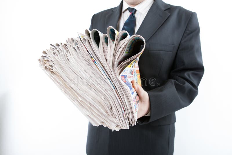 Man S Hands Holding a Stack of Newspapers Stock Image - Image of ...