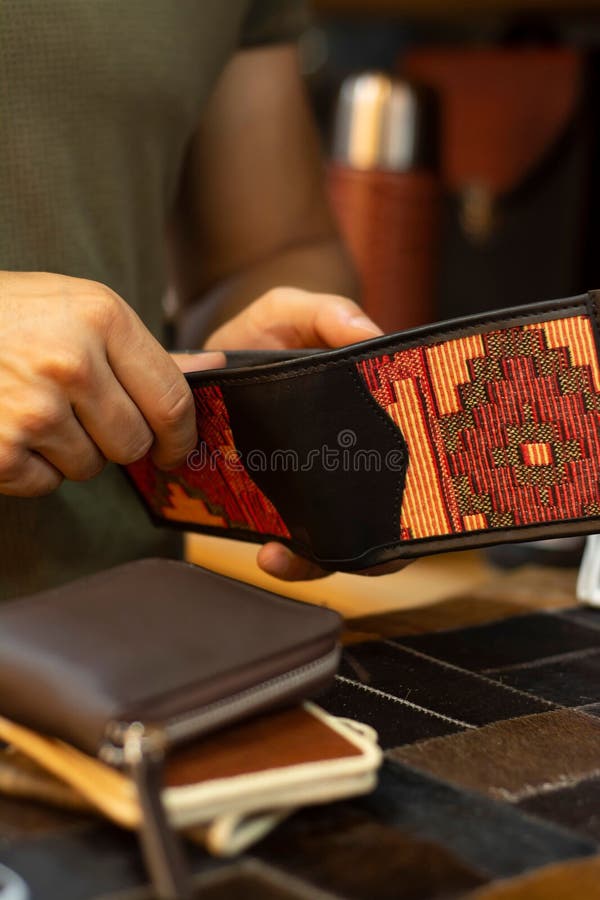 Man S Hands Holding a Wallet with Traditional Patterns. Stock Image ...