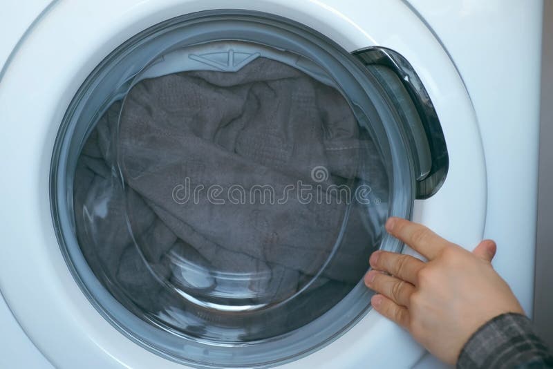Man Loading His Washing Machine Stock Photos - Free & Royalty-Free ...