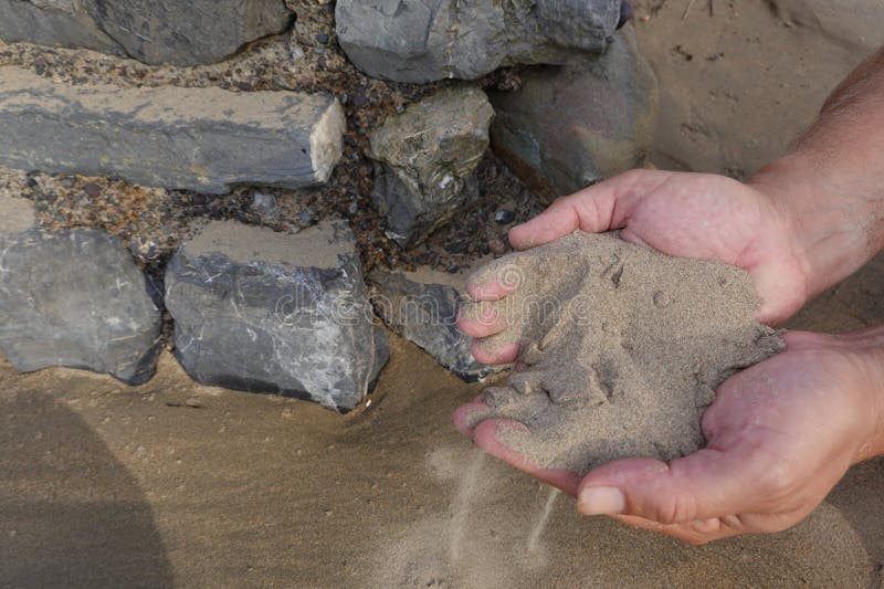 Man S Hands Picking Up Sand from the Beach. Beach Sand in Hands Stock ...