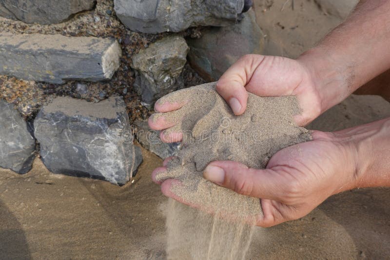 Man S Hands Picking Up Sand from the Beach. Beach Sand in Hands Stock ...