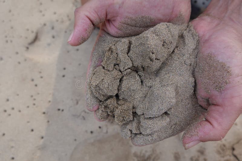 Man S Hands Picking Up Sand from the Beach. Beach Sand in Hands Stock ...