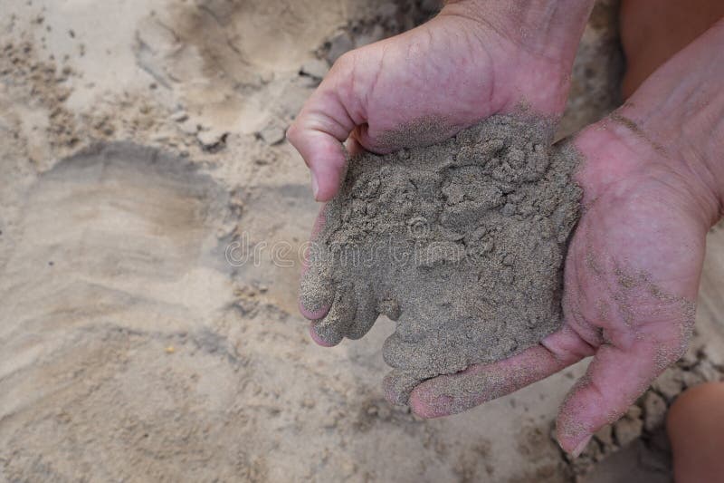 Man S Hands Picking Up Sand from the Beach. Beach Sand in Hands Stock ...