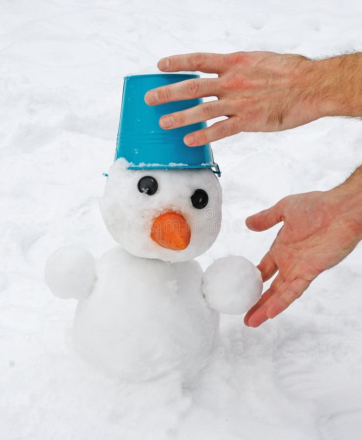 Man s hands sculpt snowman stock photo. Image of february - 28637088