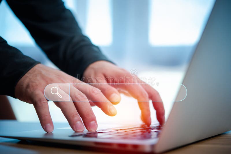Man`s Hands are Using a Computer Notebook To Searching for Information ...