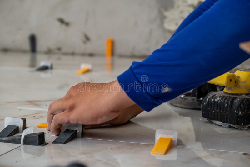 Man S Hands Using Equipment for Leveling and Spacing Floors Stock Photo ...