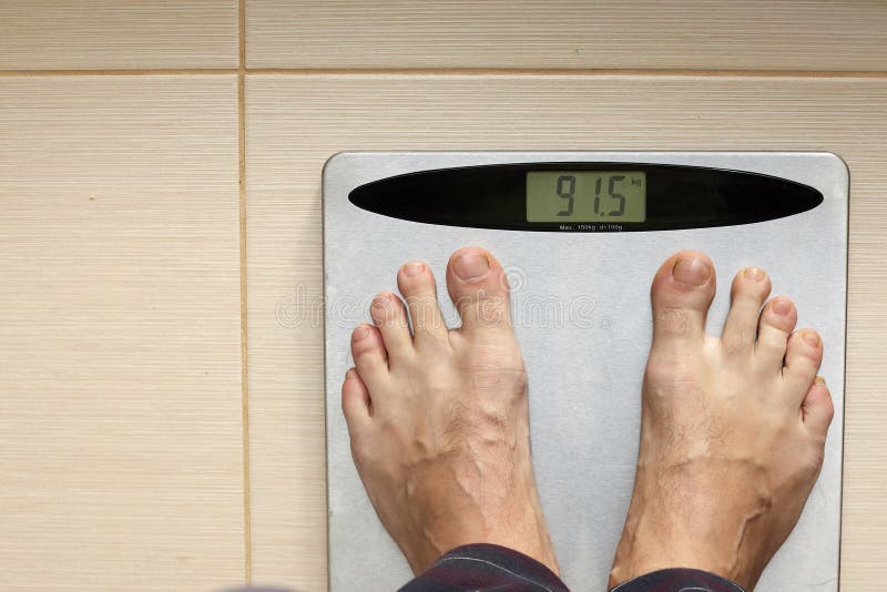 Man`s leg on a scale. stock image. Image of mans, measure - 114642023