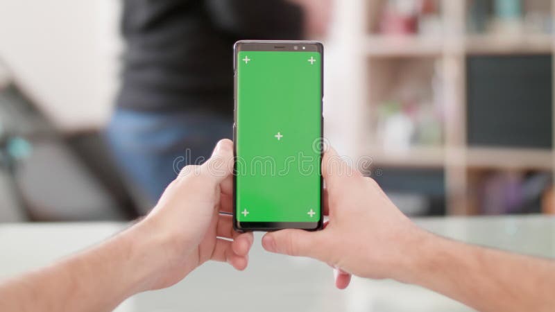 Top View of Holding Smart Phone with Green Screen and Camera on ...