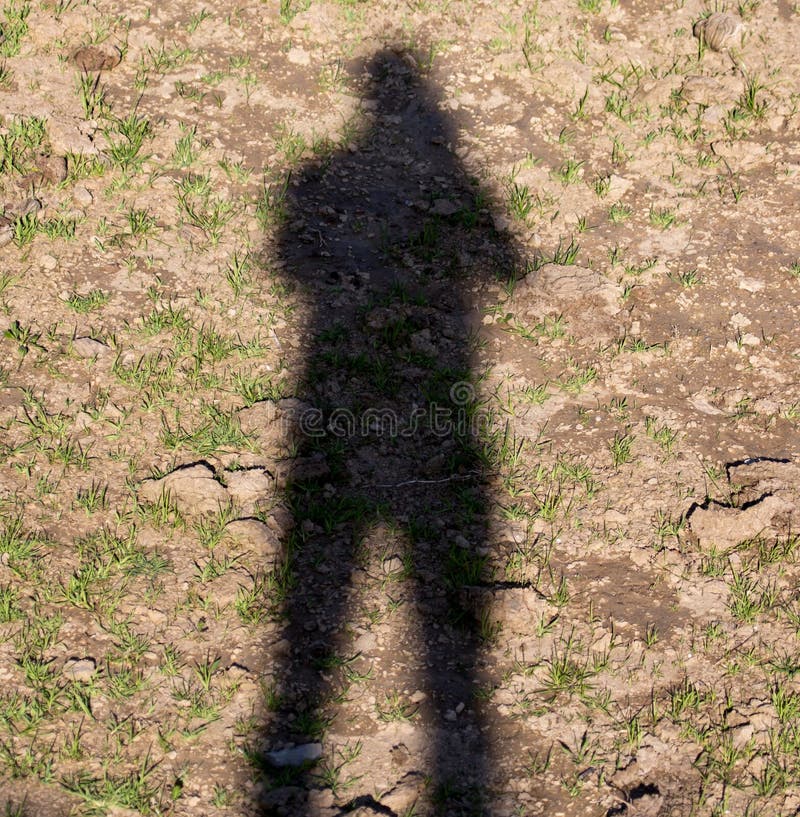Man`s shadow on the ground stock photo. Image of nature - 92900978