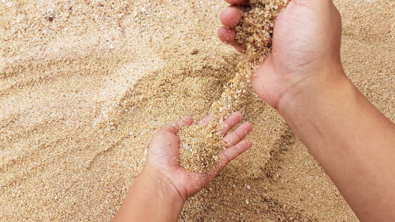 Man`s Upper Hand Throwing the Sand on Lower Hand Stock Image - Image of ...