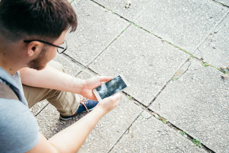 Man Holding Smartphone with Cracked Screen Stock Photo - Image of ...
