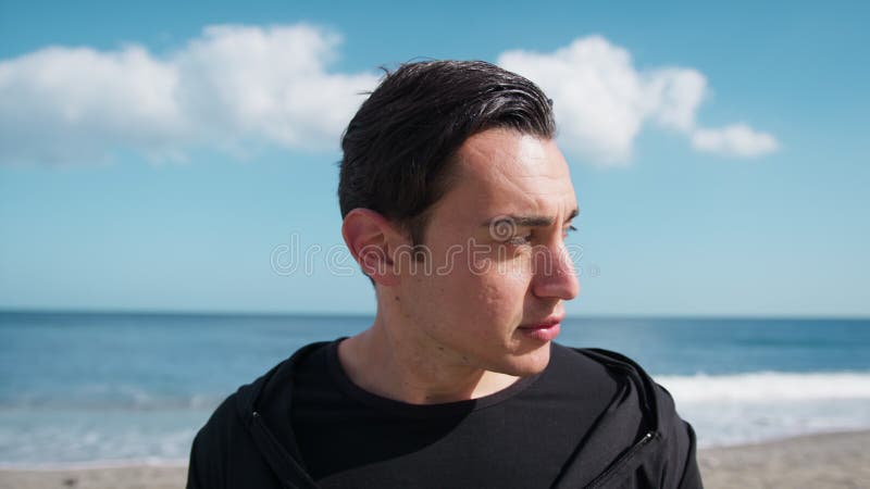 Man Sad Looks Left and Right on the Beach Near the Sea Stock Footage ...