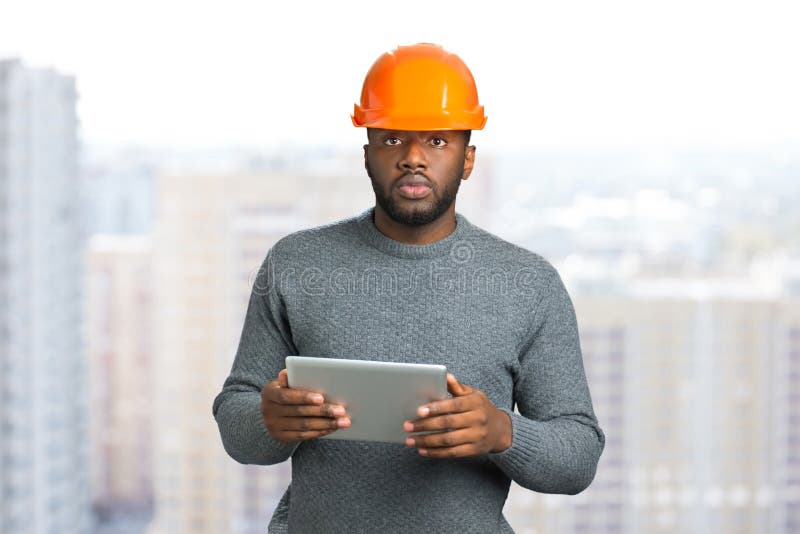 Man in Safety Helmet and Computer Tablet. Stock Image - Image of grey ...