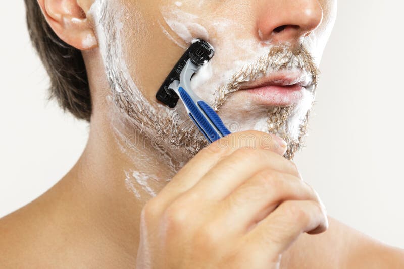 Man with a Safety Razor and Shaving Cream on His Face Stock Photo ...