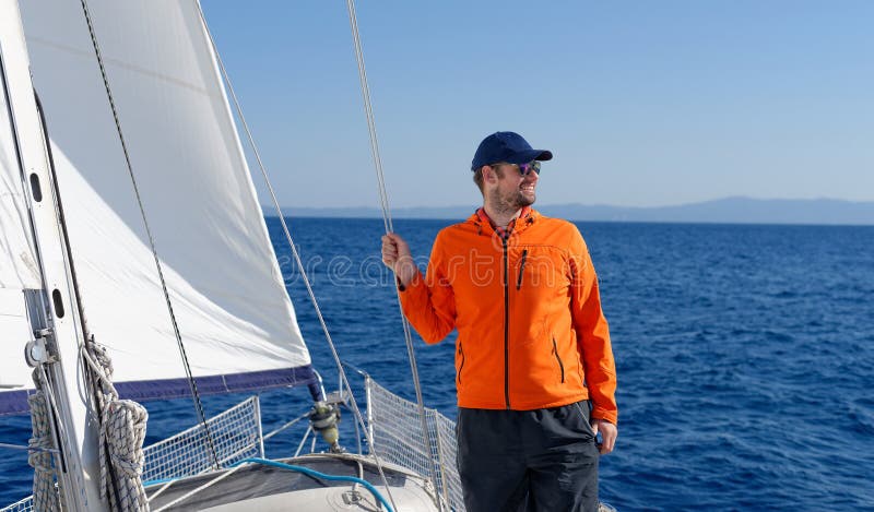 Man sailing with sails out stock image. Image of blue - 186975509