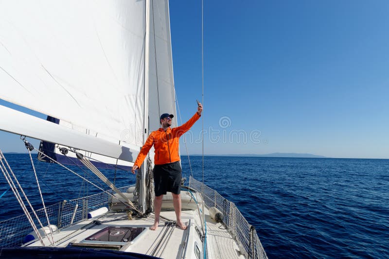 Man sailing with sails out stock image. Image of happy - 186975551