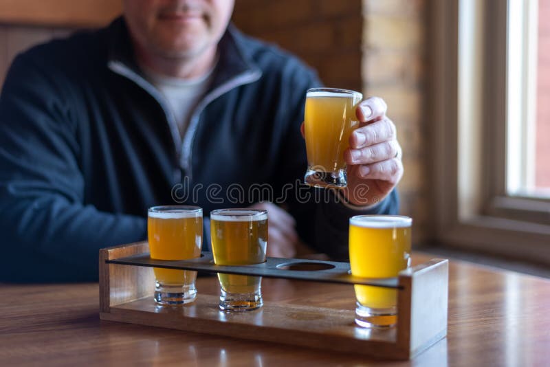 Man Sampling Beer at a Restaurant Stock Photo - Image of drinking ...