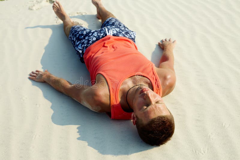 Man on sand stock photo. Image of handsome, relaxing - 34210256